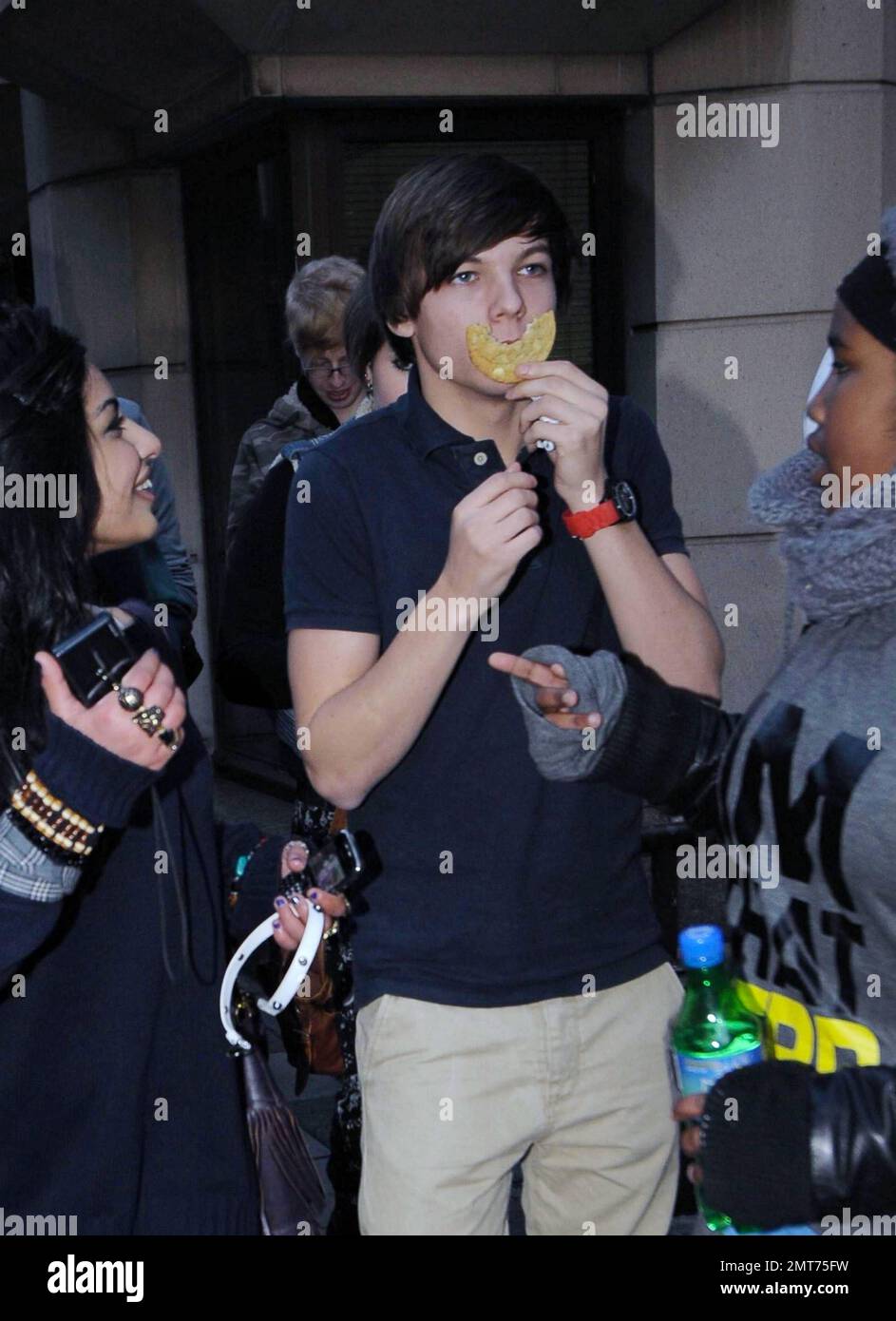 "X Factor" boy band One Direction clowns around on the streets of the ...