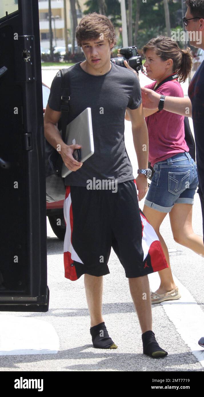 The boys from the British band 'One Direction' get mobbed as they leave ...