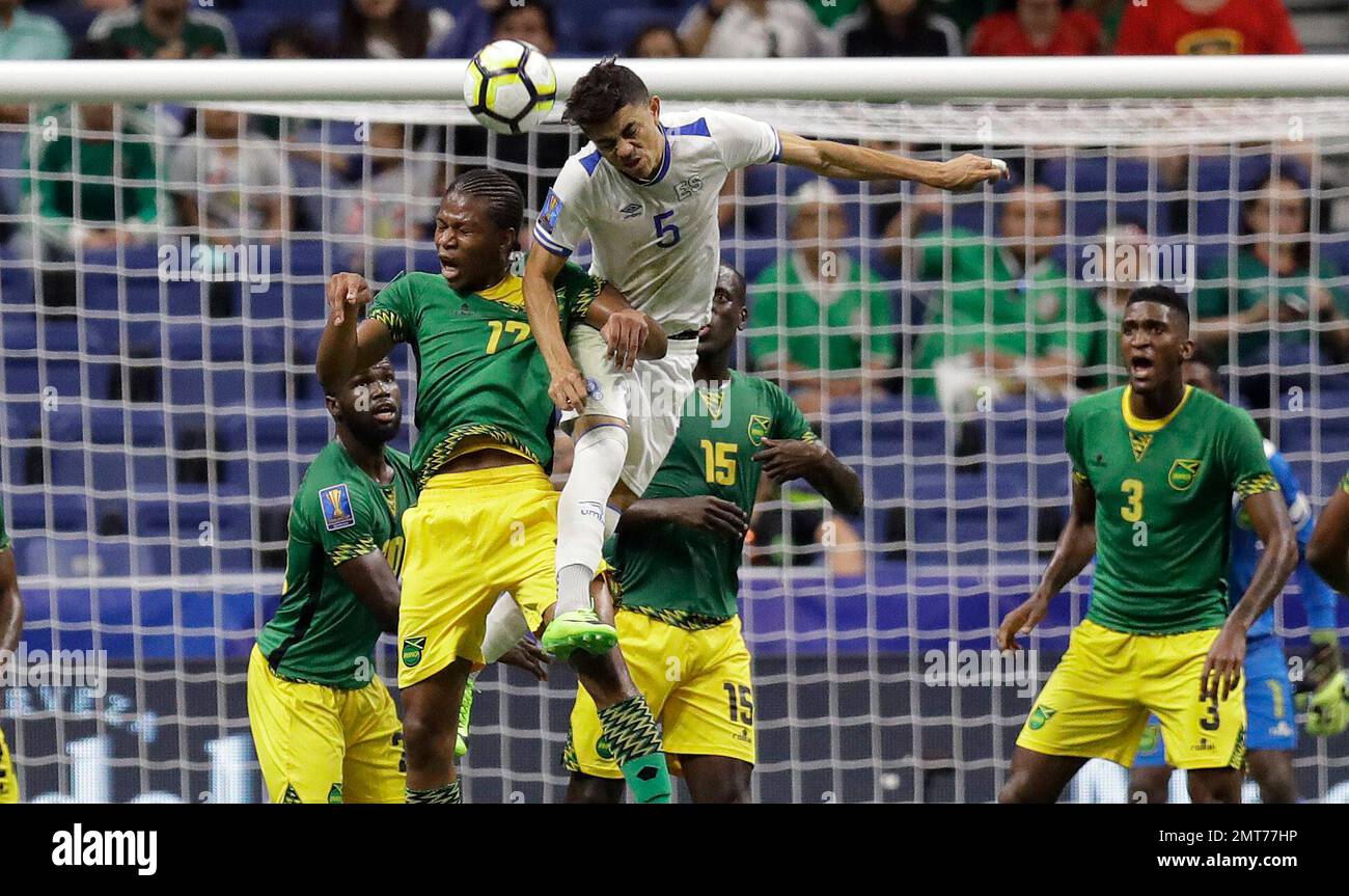 Jamaica's Kevon Lambert (17) and El Salvador's Ivan Mancia (5) leap to ...