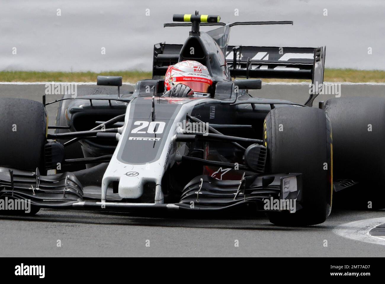 Haas driver Kevin Magnussen of Denmark takes a curve during the British ...