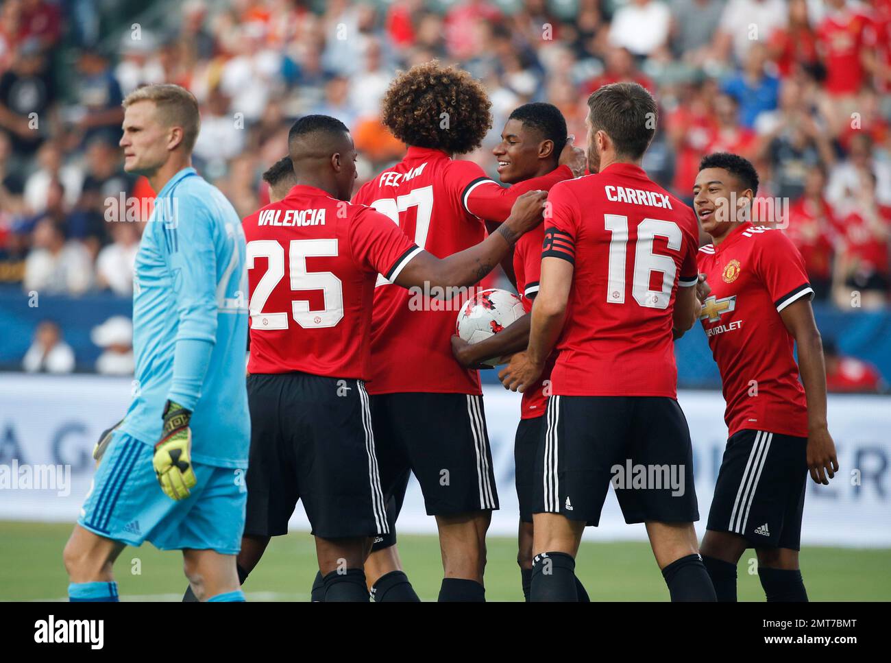 Manchester United players celebrate a goal by Marcus Rashford, third ...
