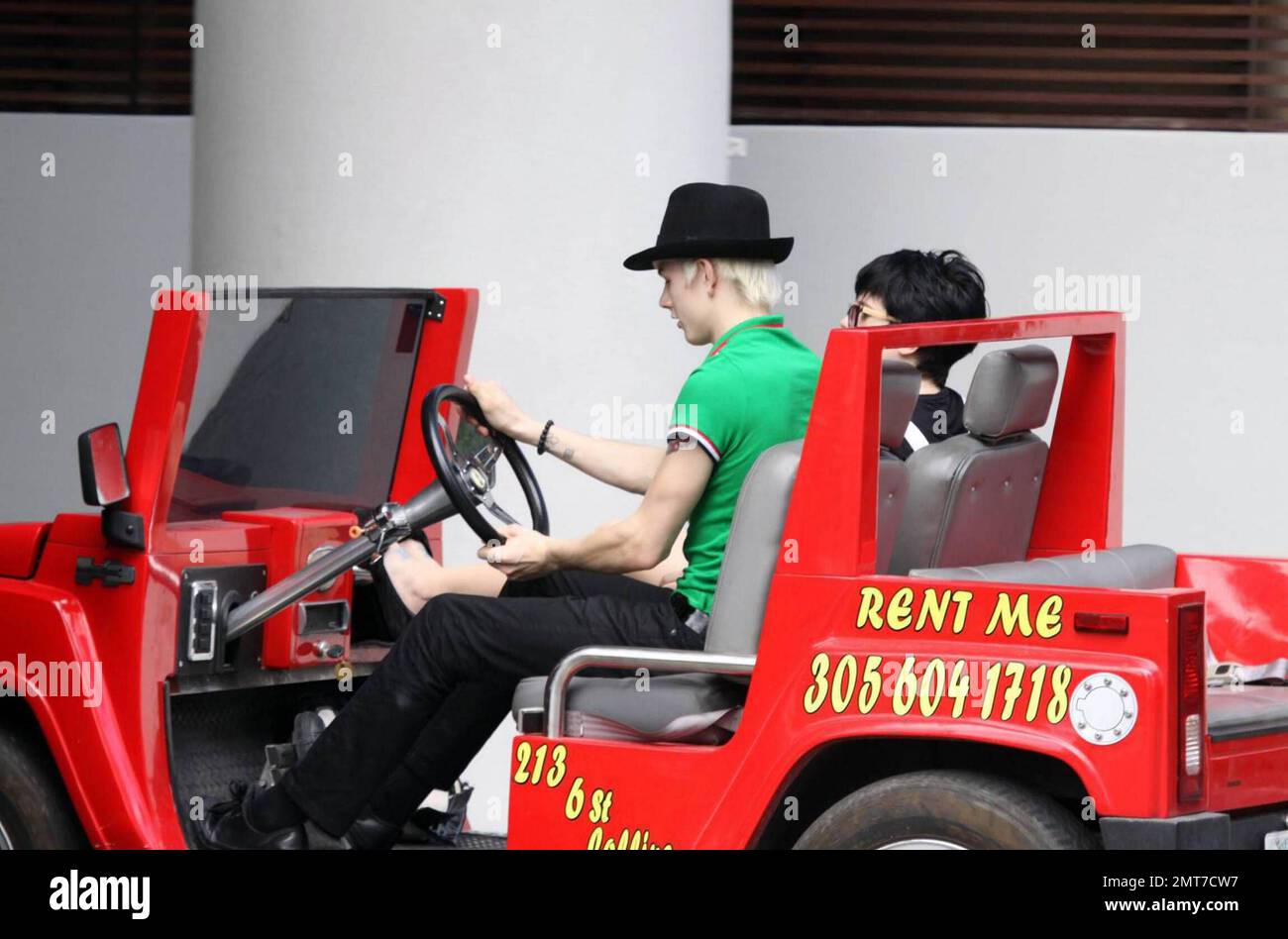 Kelly Osbourne and Luke Worrell take a ride in a mini jeep. Luke drove ...