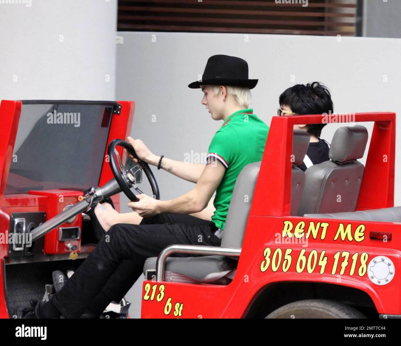 Kelly Osbourne and Luke Worrell take a ride in a mini jeep. Luke drove ...
