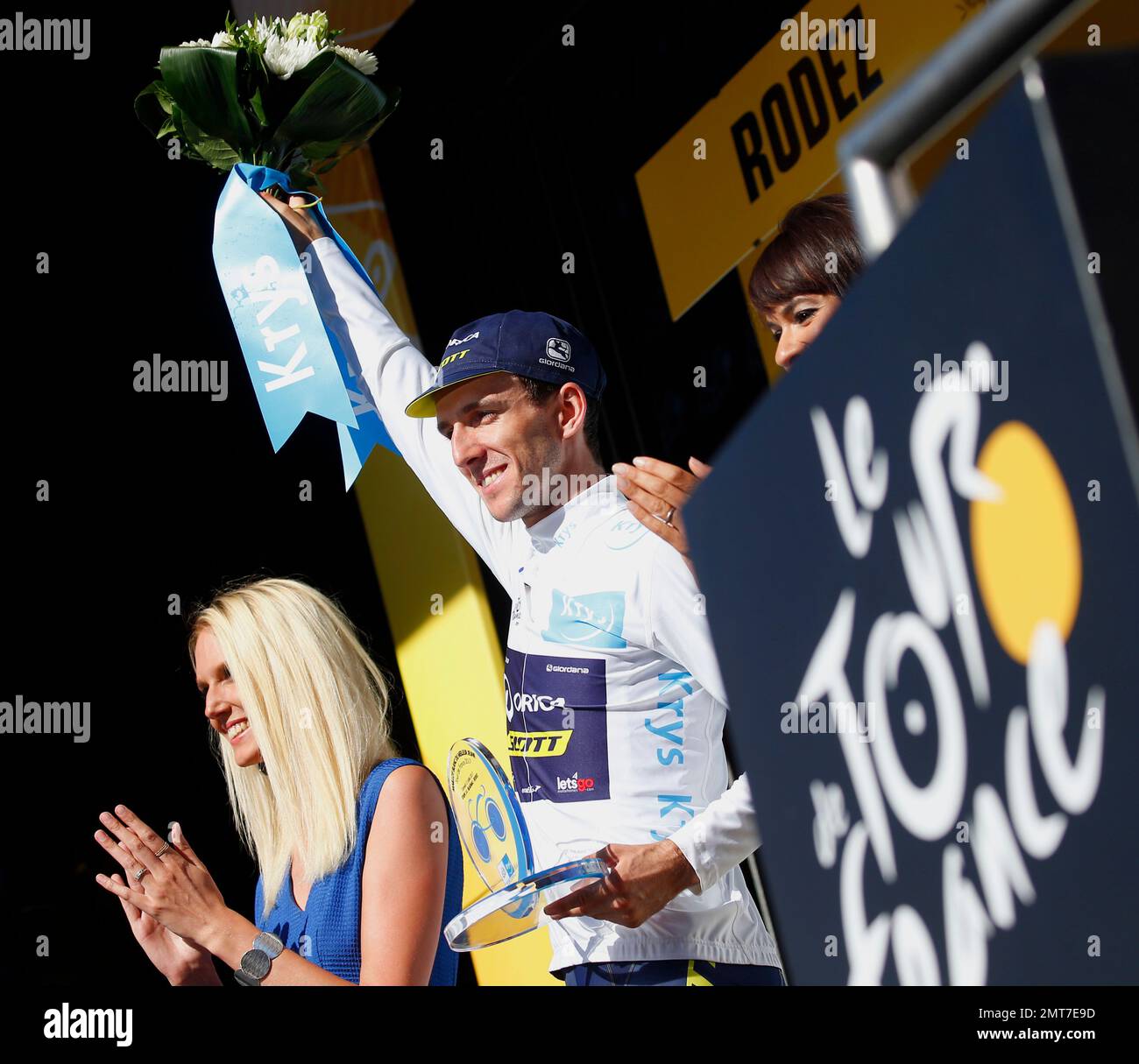 Britain's Simon Yates, wearing the best young rider's white jersey ...