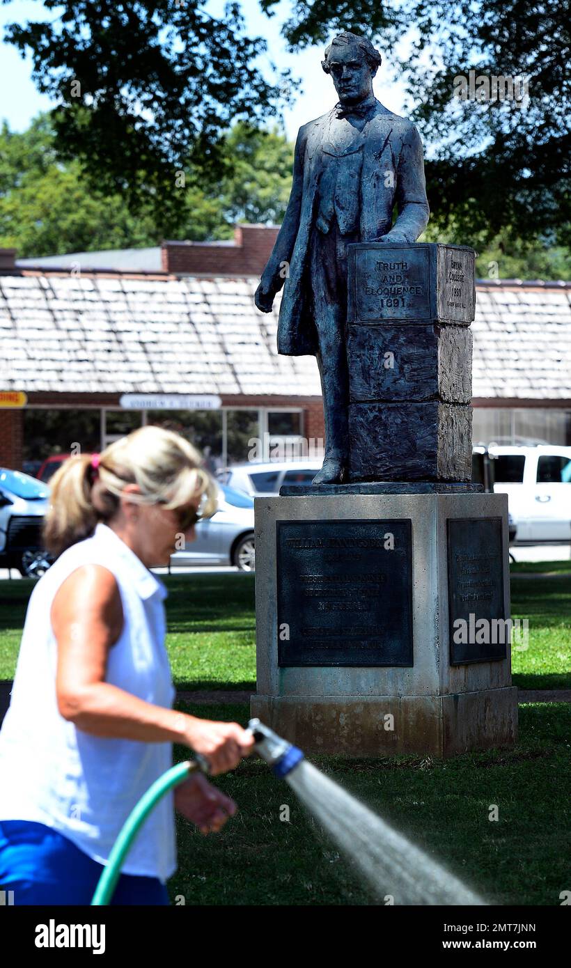 Susan Tallent waters flowers near the William Jennings Bryan statue in ...