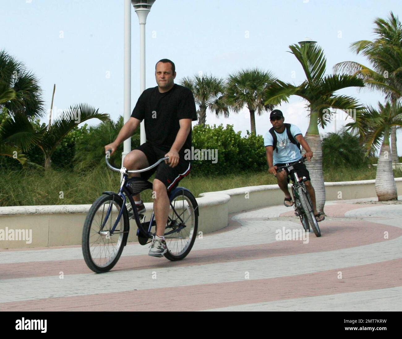 Exclusive!! Owen Wilson and Vince Vaughn take a Sunday afternoon bike ride along the Miami Beach ...