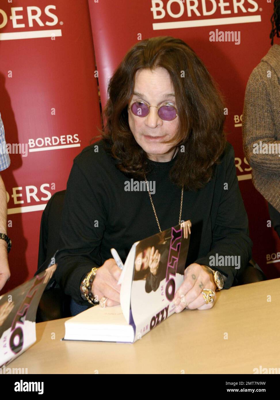 Ozzy Osbourne signs copies of his book "I Am Ozzy" at Borders Books in ...