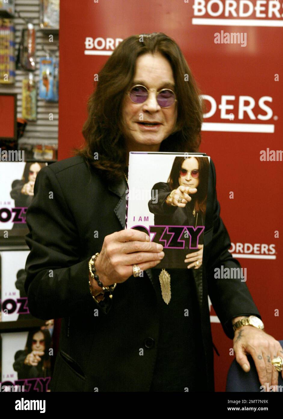 Ozzy Osbourne signs copies of his book "I Am Ozzy" at Borders Books in ...