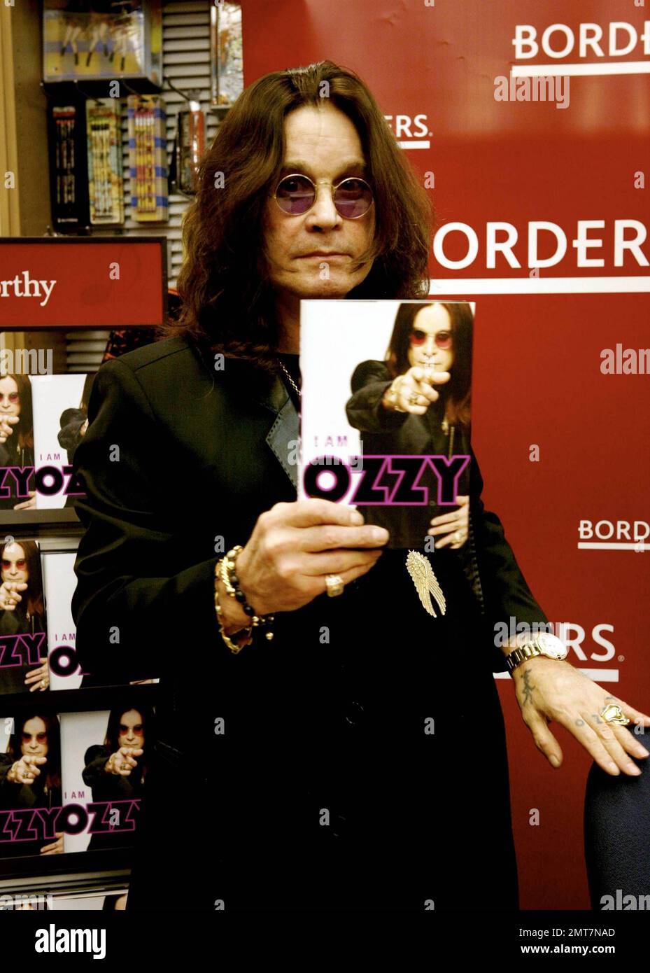 Ozzy Osbourne signs copies of his book "I Am Ozzy" at Borders Books in ...