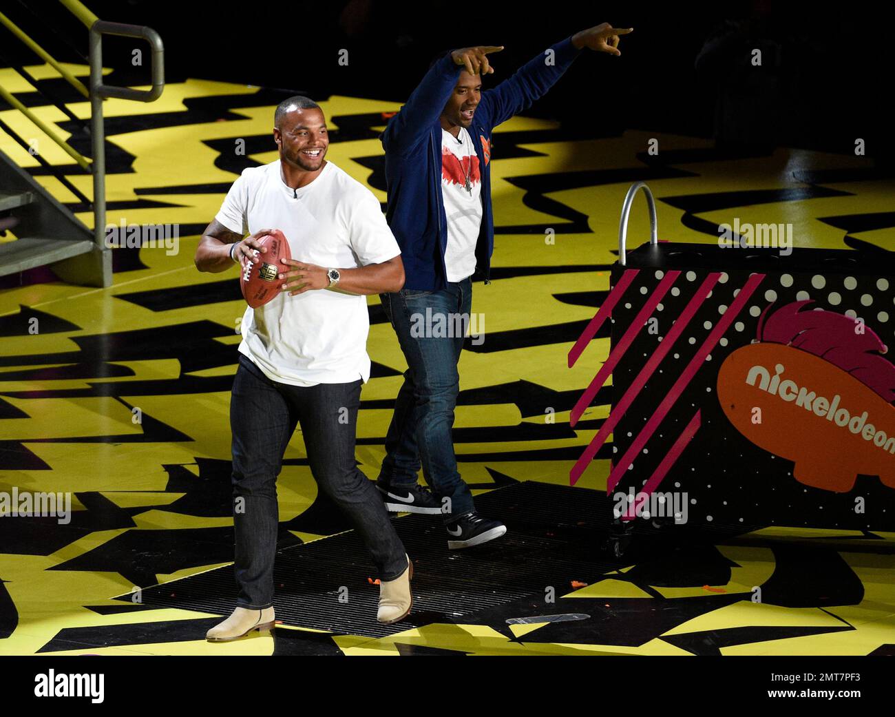 Host Russell Wilson, right, and Dak Prescott participate in the $50,000 ...