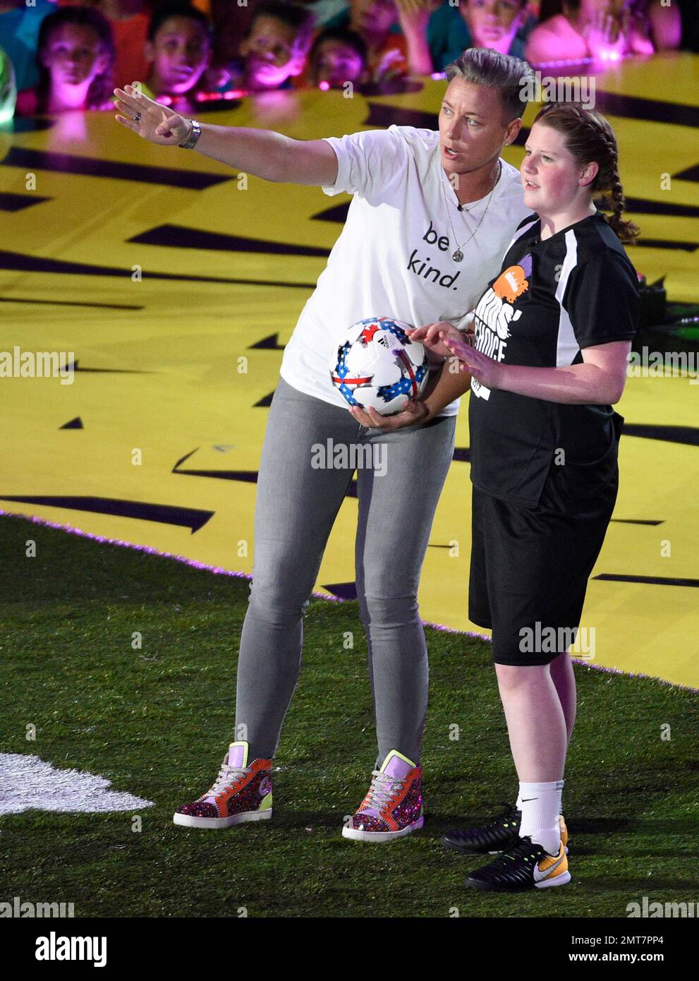 Abby Wambach, left, coaches Evelyn Grace Briggs during a $50,000 soccer ...