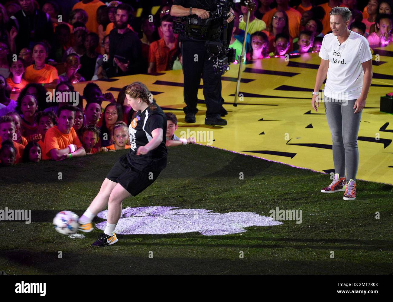 Abby Wambach, right, and Evelyn Grace Briggs participate is a $50,000 ...