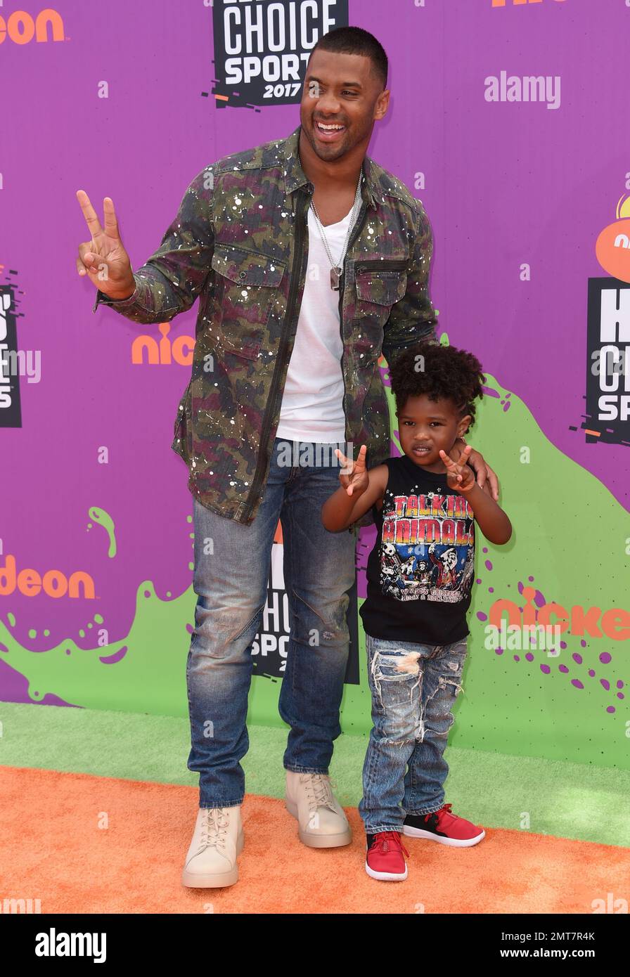 NFL football player Russell Wilson, of the Seattle Seahawks, left, and ...