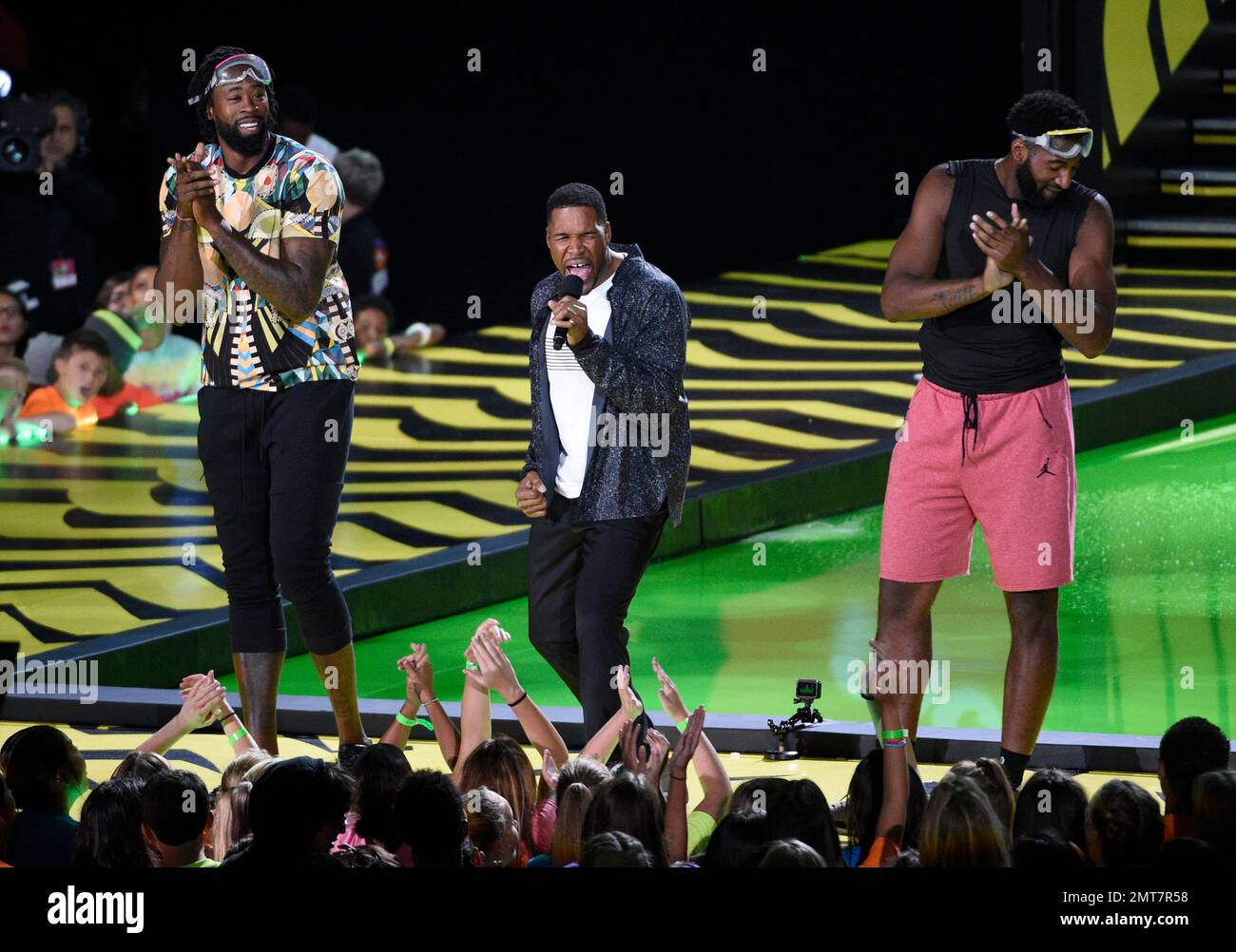 DeAndre Jordan, left, Michael Strahan and Andre Drummond participate in ...