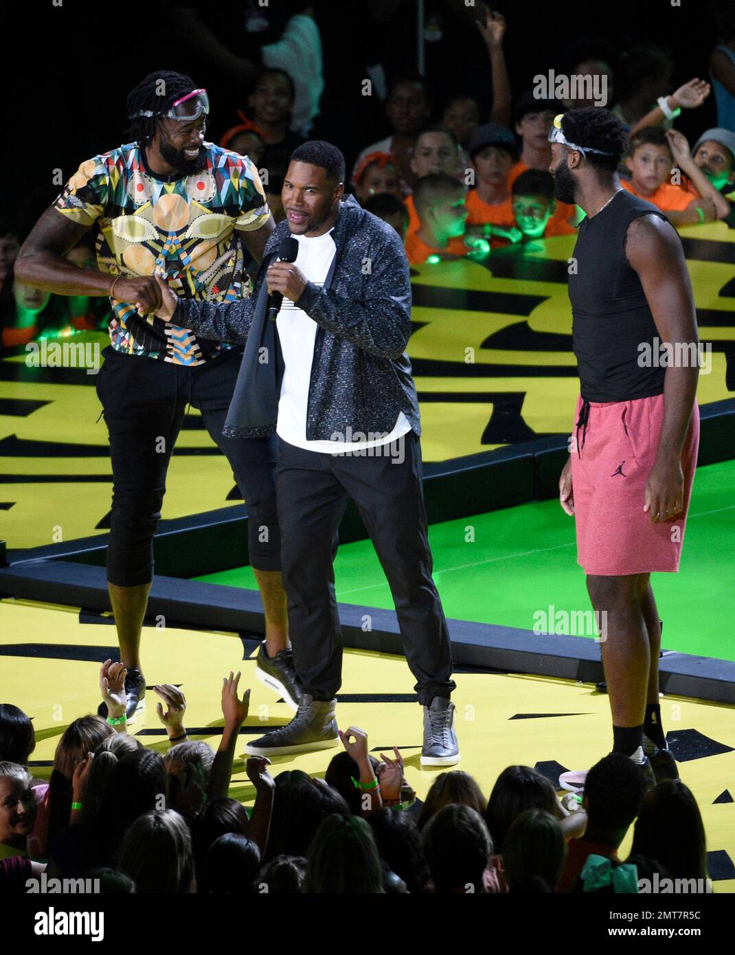 DeAndre Jordan, left, Michael Strahan and Andre Drummond participate in ...