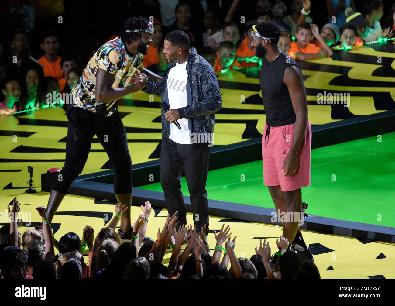 DeAndre Jordan, left, Michael Strahan and Andre Drummond participate in ...