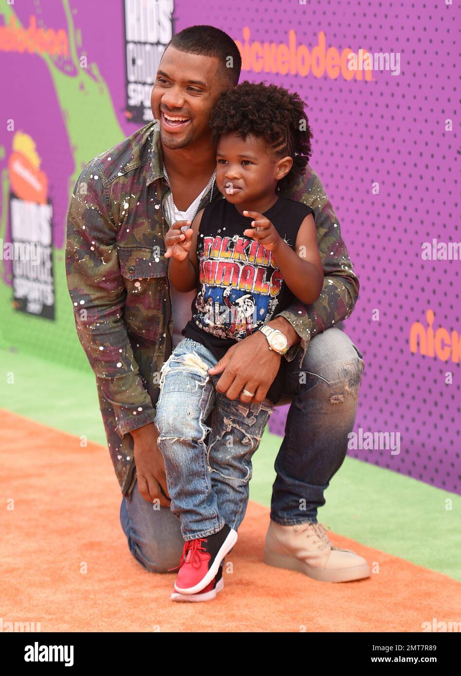 NFL football player Russell Wilson, of the Seattle Seahawks, left, and ...