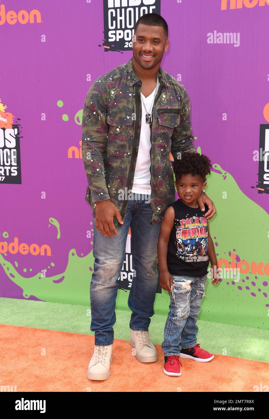 NFL football player Russell Wilson, of the Seattle Seahawks, left, and ...