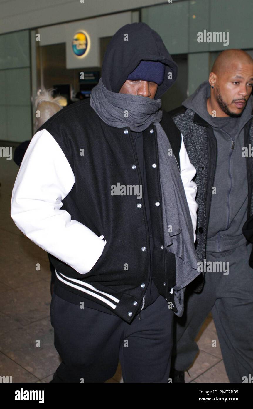Sean diddy arrives at terminal of heathrow airport hi-res stock ...