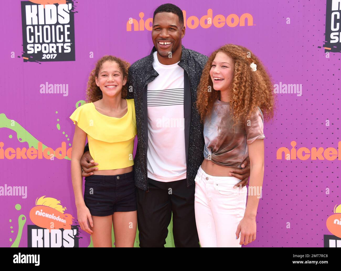Michael Strahan, center, and his daughters Sophia Strahan, left, and ...