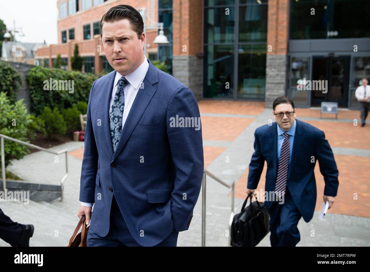 Defense lawyers Paul Lang, left, and Michael Parlow walk from the Bucks ...