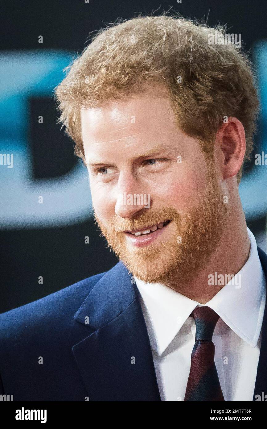 Britain's Prince Harry poses for photographers upon arrival at the ...
