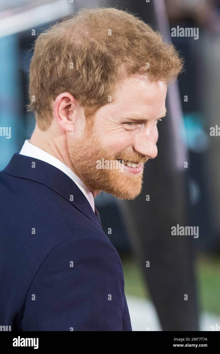 Britain's Prince Harry poses for photographers upon arrival at the ...