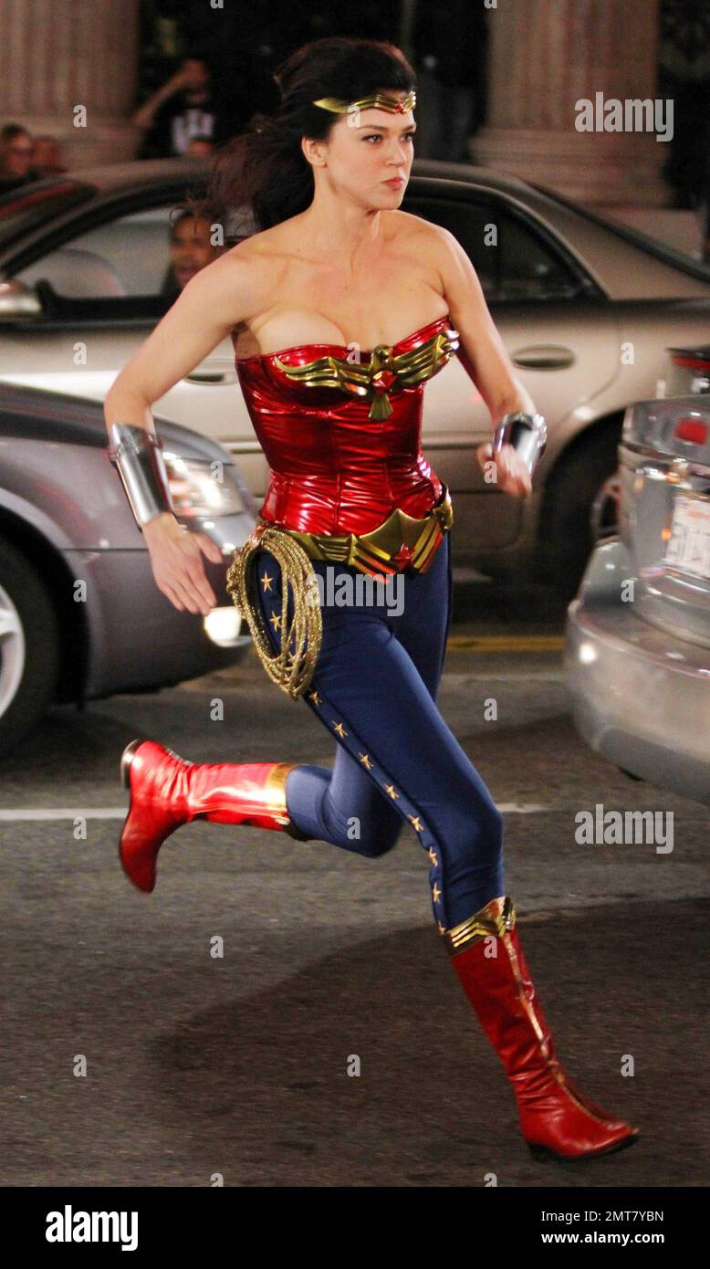 Adrianne Palicki dashes around set and shows off her figure in her ...