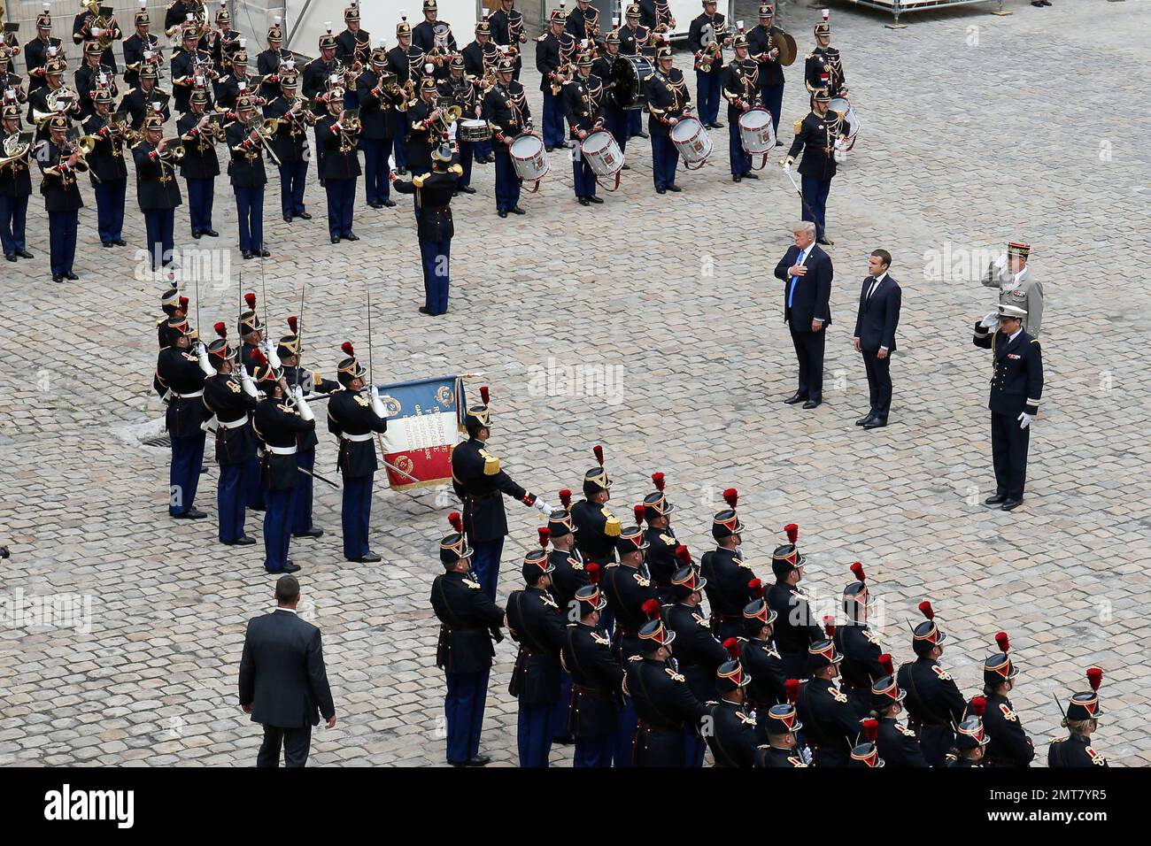 French President Emmanuel Macron and US President Donald Trump stand at ...