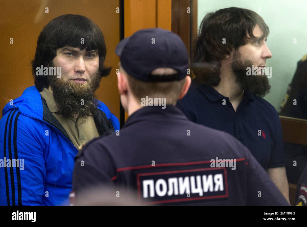 Anzor Gubashev, left, and Zaur Dadayev, right, listen to the sentence ...