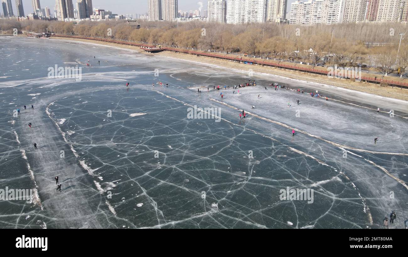 Aerial photos show people skating on the frozen Hun River in ...