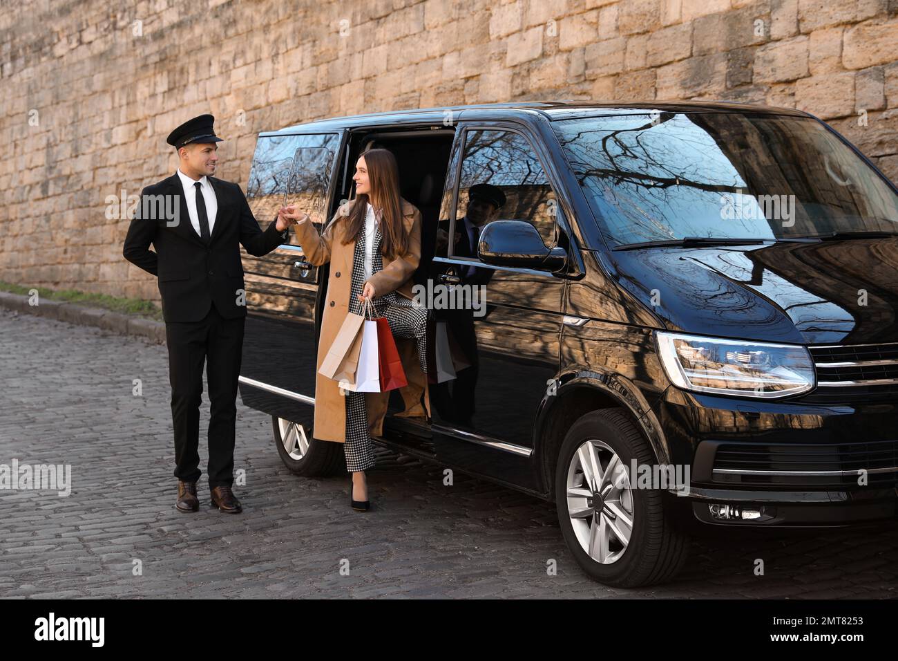 Man helping woman out of car hi-res stock photography and images - Alamy