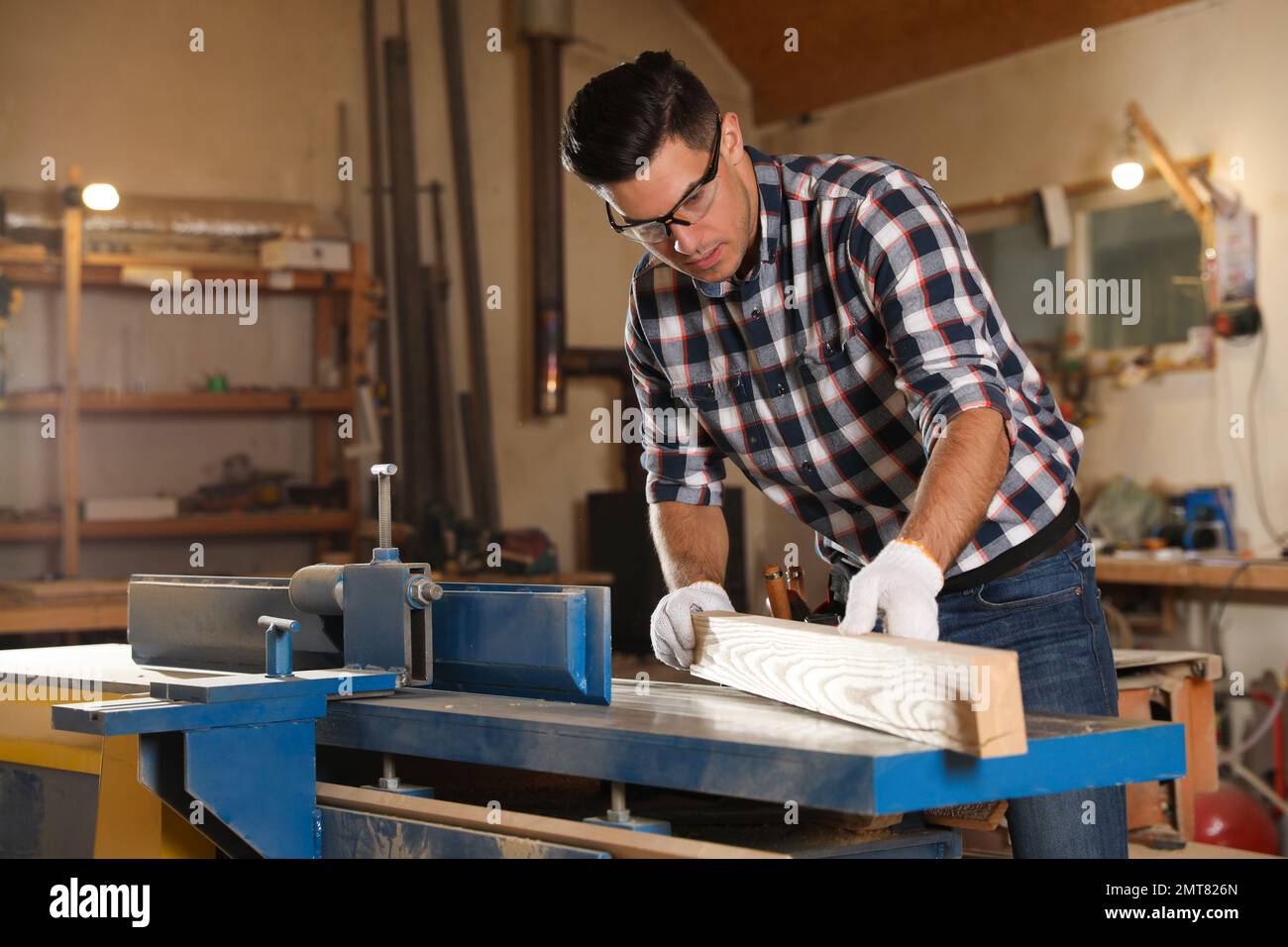 Professional carpenter checking surface wooden hi-res stock photography ...