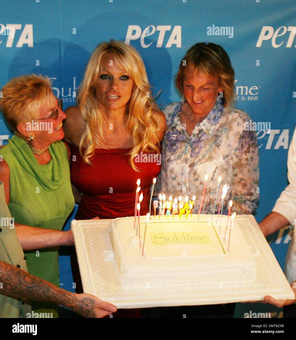 Pamela Anderson blows out the candles for her 40th with PETA president ...