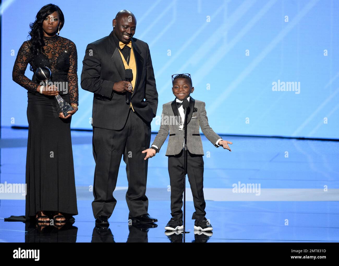 New Orleans Saints superfan Jarrius "J.J." Robertson, right, accepts ...