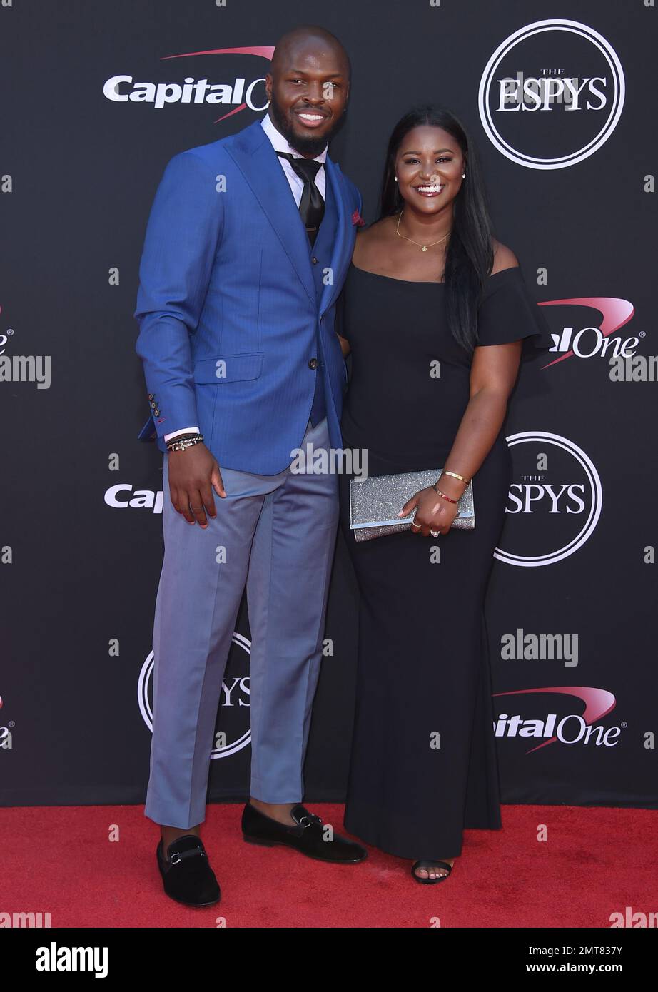 NFL football player Alec Ogletree, of the Los Angeles Rams, left, and ...