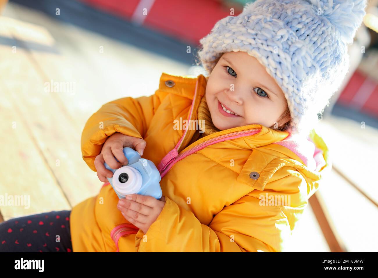 Cute little photographer with toy camera outdoors Stock Photo - Alamy