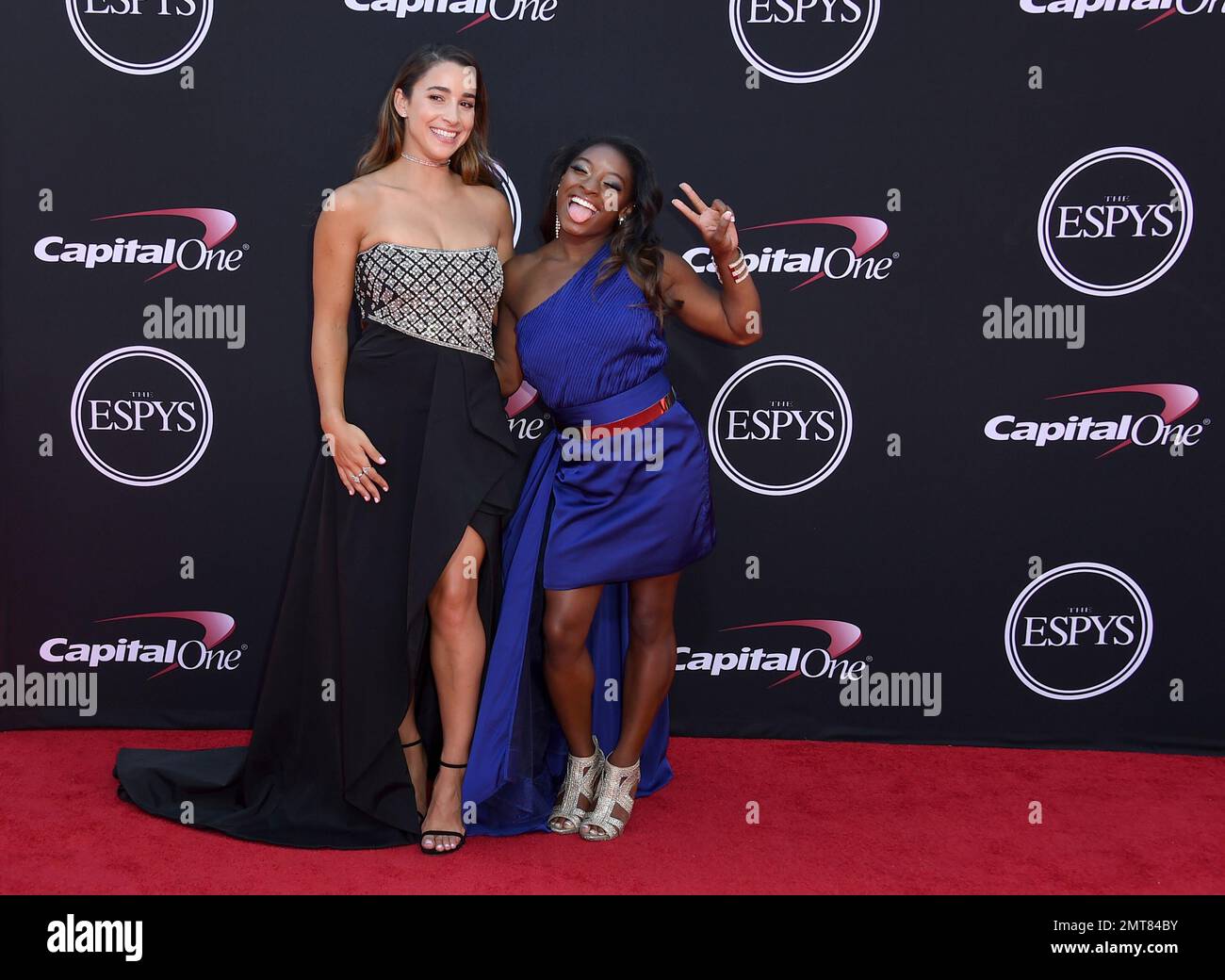 Gymnasts Aly Raisman, left, and Simone Biles arrive at the ESPYS at the Microsoft Theater on ...