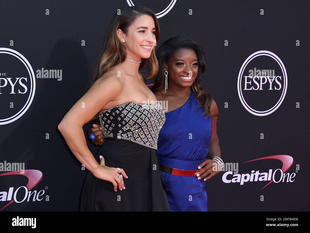 Gymnasts Aly Raisman, left, and Simone Biles arrive at the ESPYS at the Microsoft Theater on ...