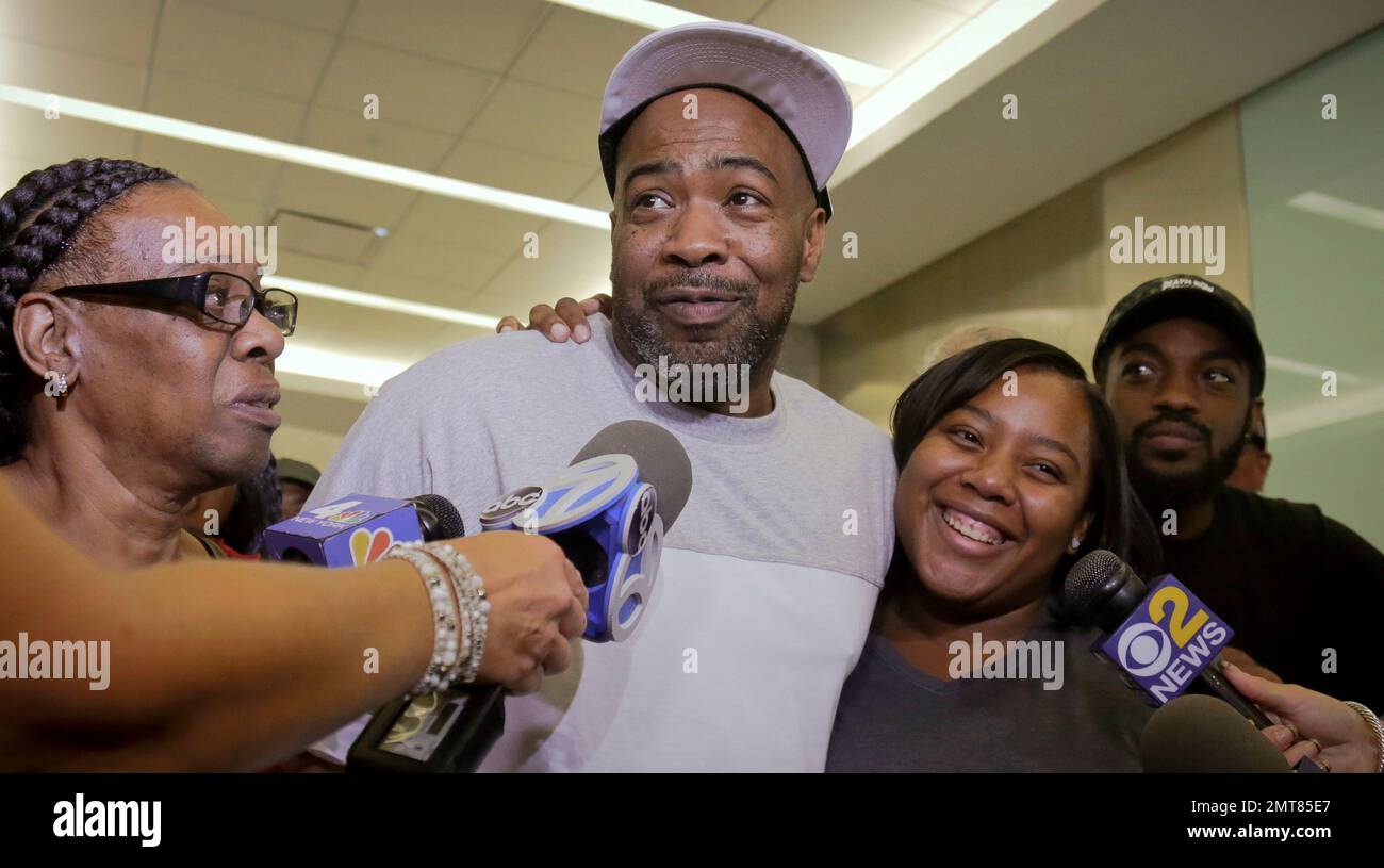Jabbar Washington, 43, second from left, is surrounded by family ...