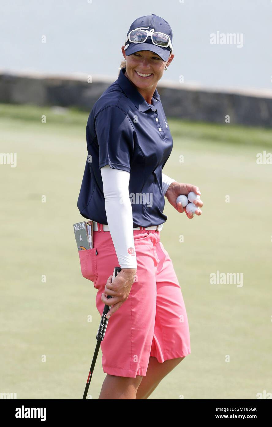 Katherine Kirk of Australia smiles while practicing her putts during a ...