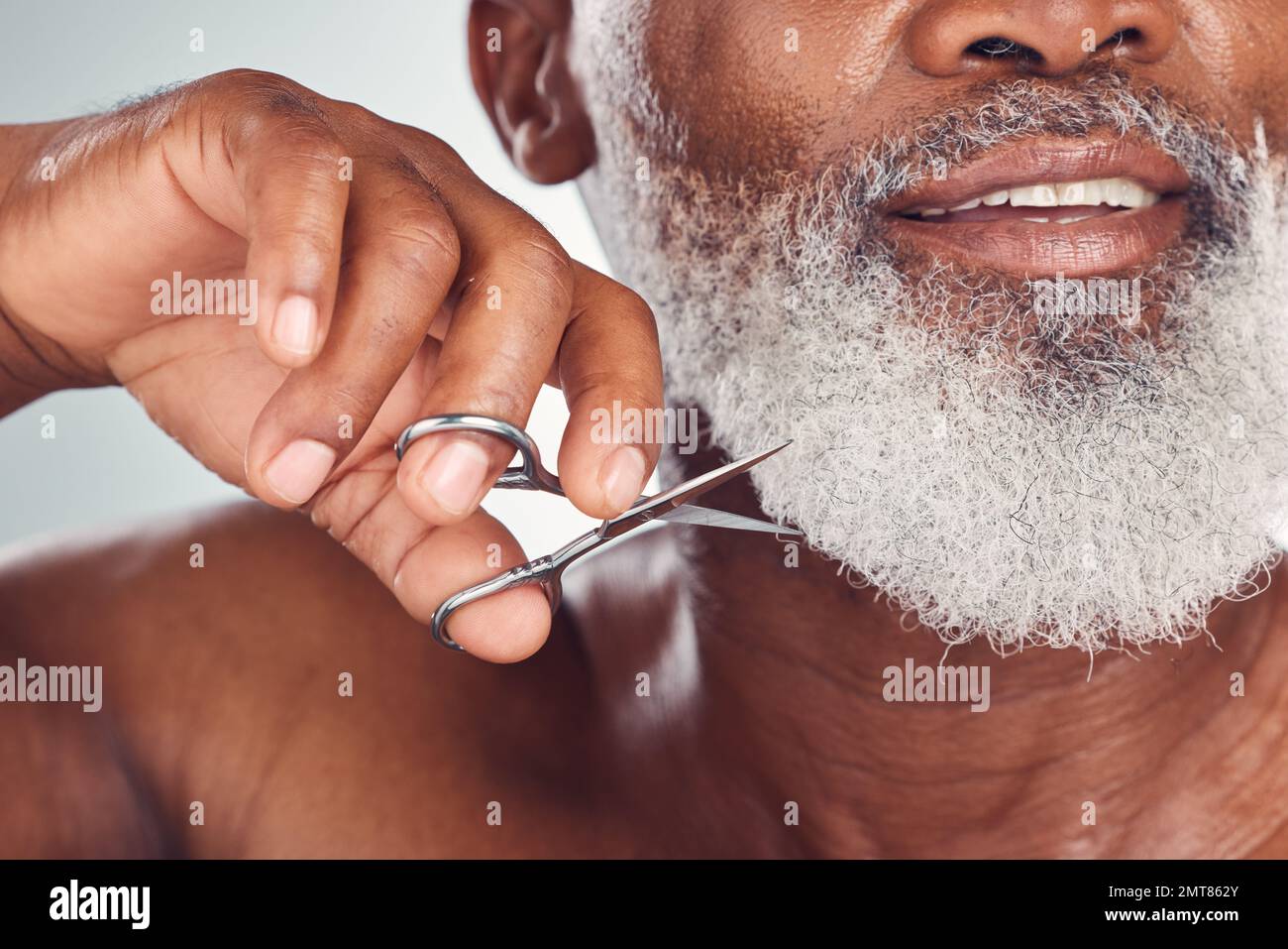 Black man face, beard with scissors and beauty with grooming and ...
