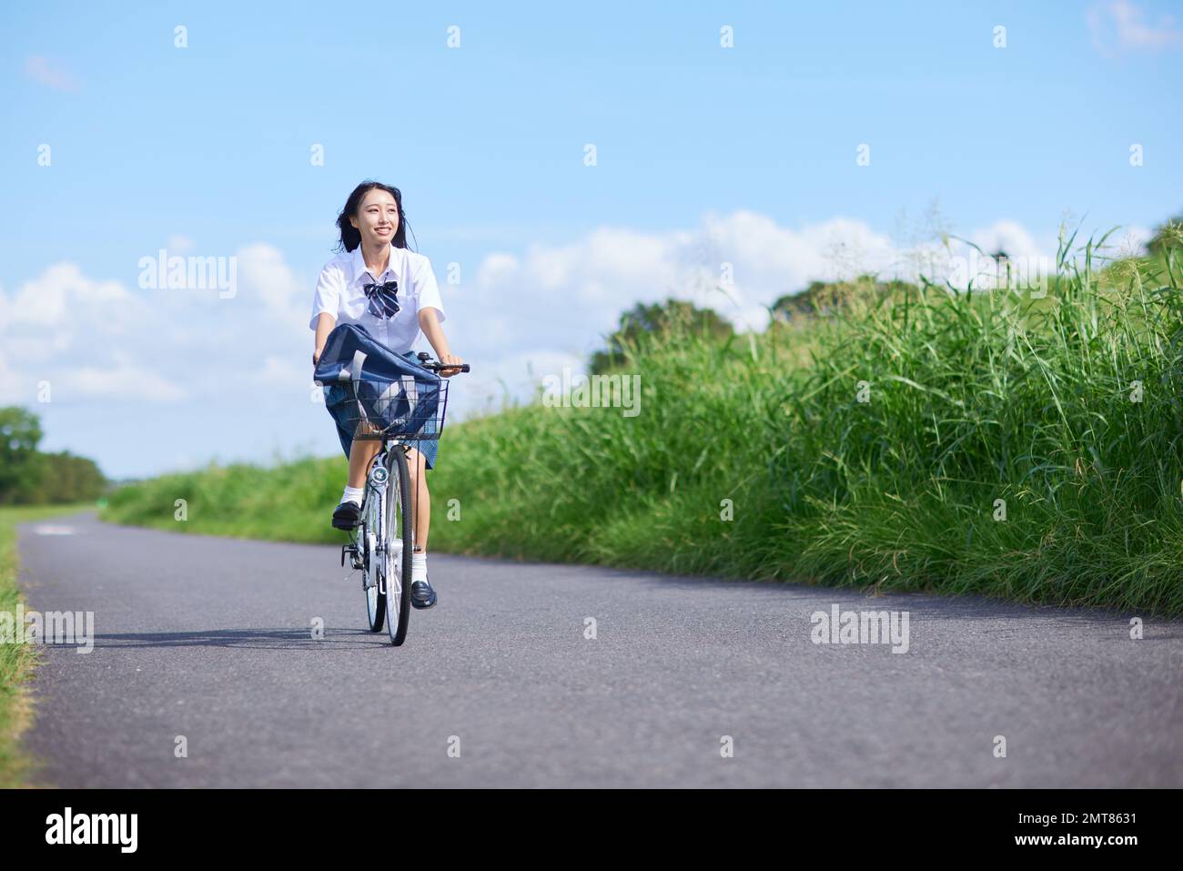 Girl riding bicycle road school hi-res stock photography and images - Alamy