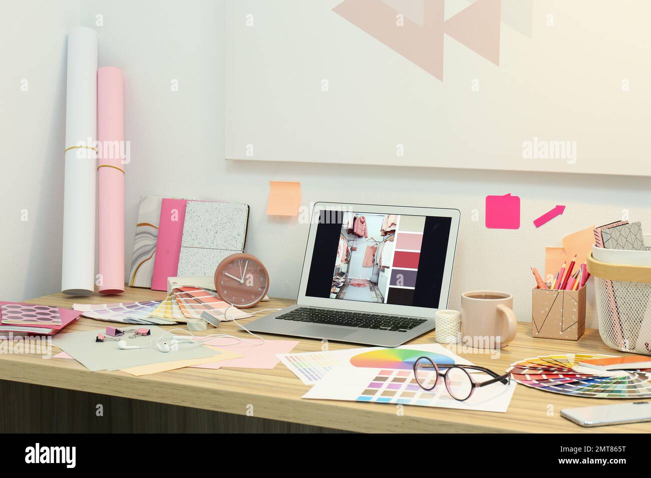 Designer's workplace with modern laptop and color palettes Stock Photo ...