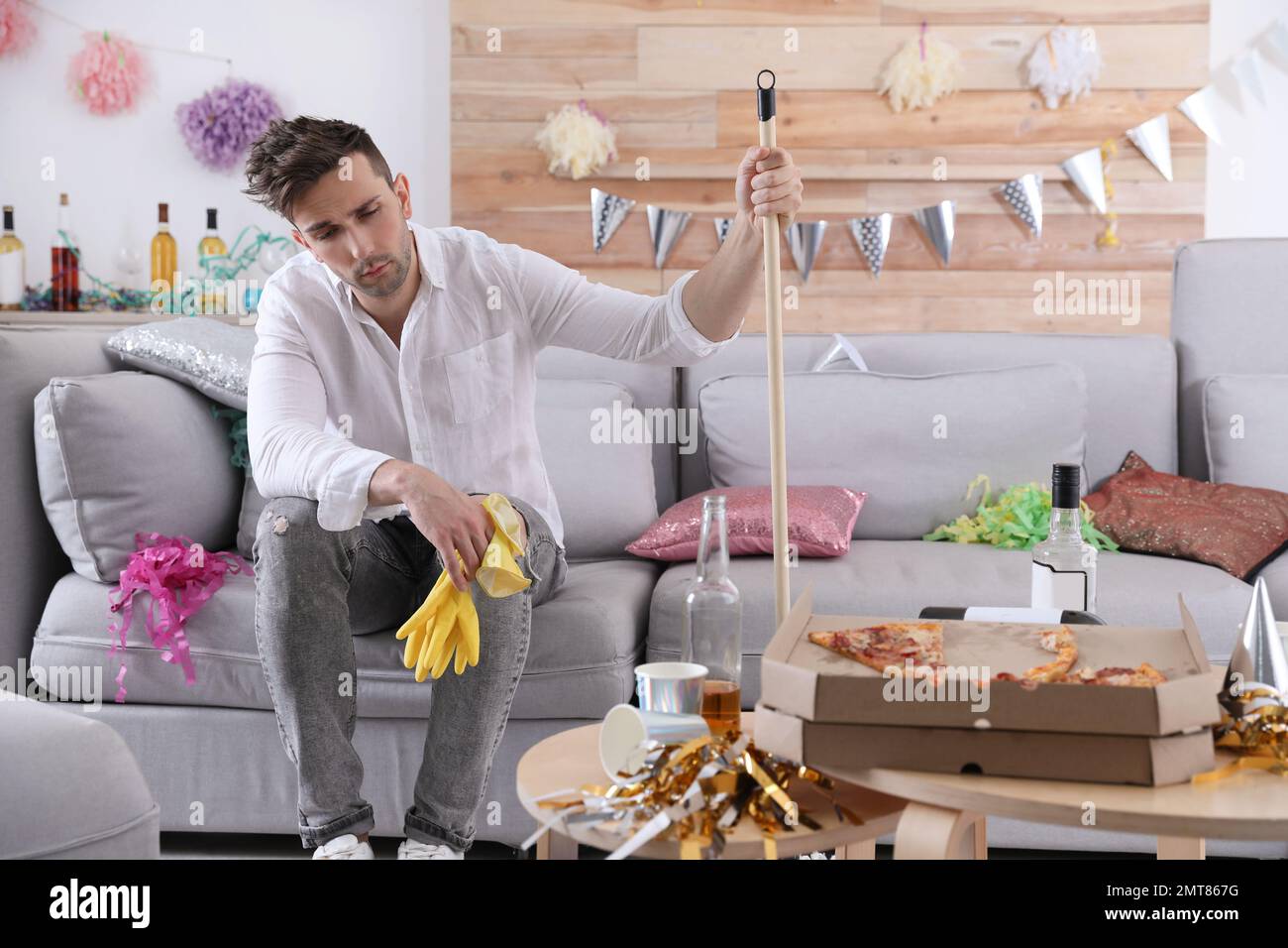 Man hangover cleaning messy hi-res stock photography and images - Alamy
