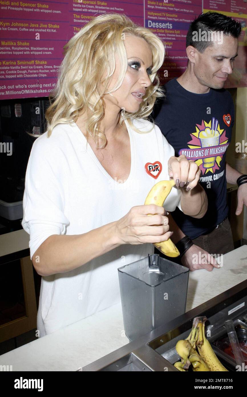 Wearing a simple white t-shirt dress and an anti-fur button, Pamela ...