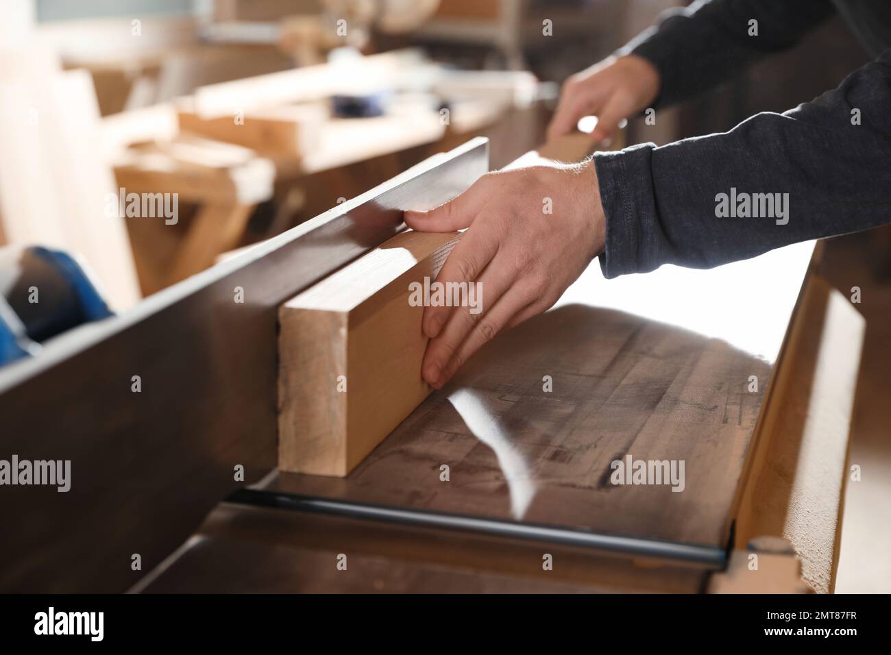 Professional carpenter working with surface planer in workshop, closeup Stock Photo - Alamy
