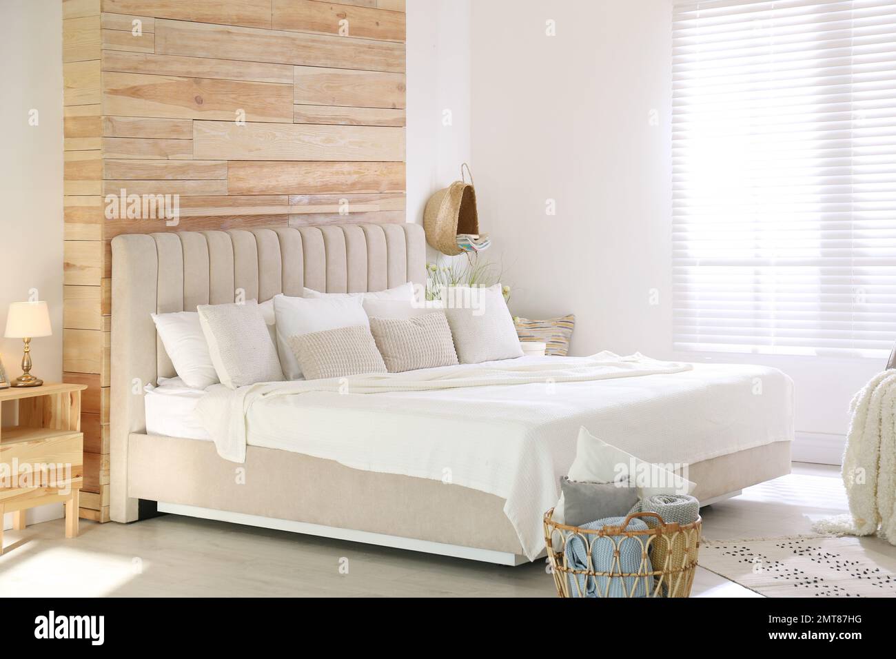 Stylish room interior with big comfortable bed Stock Photo - Alamy