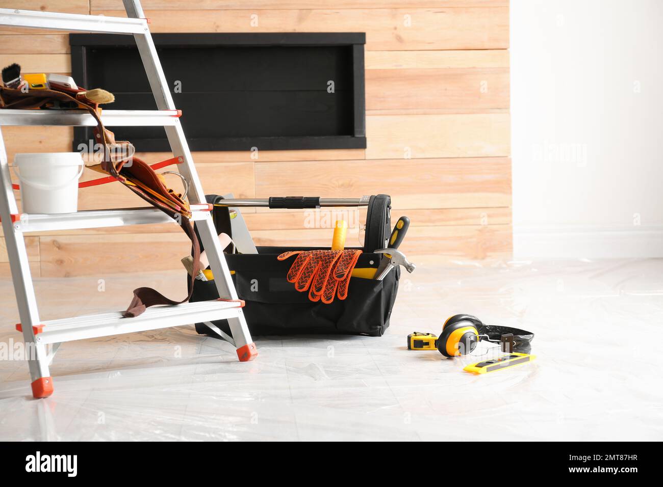 Stepladder and different tools in room. Interior renovation Stock Photo ...