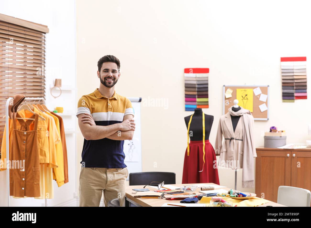 Fashion designer creating new clothes in studio Stock Photo - Alamy